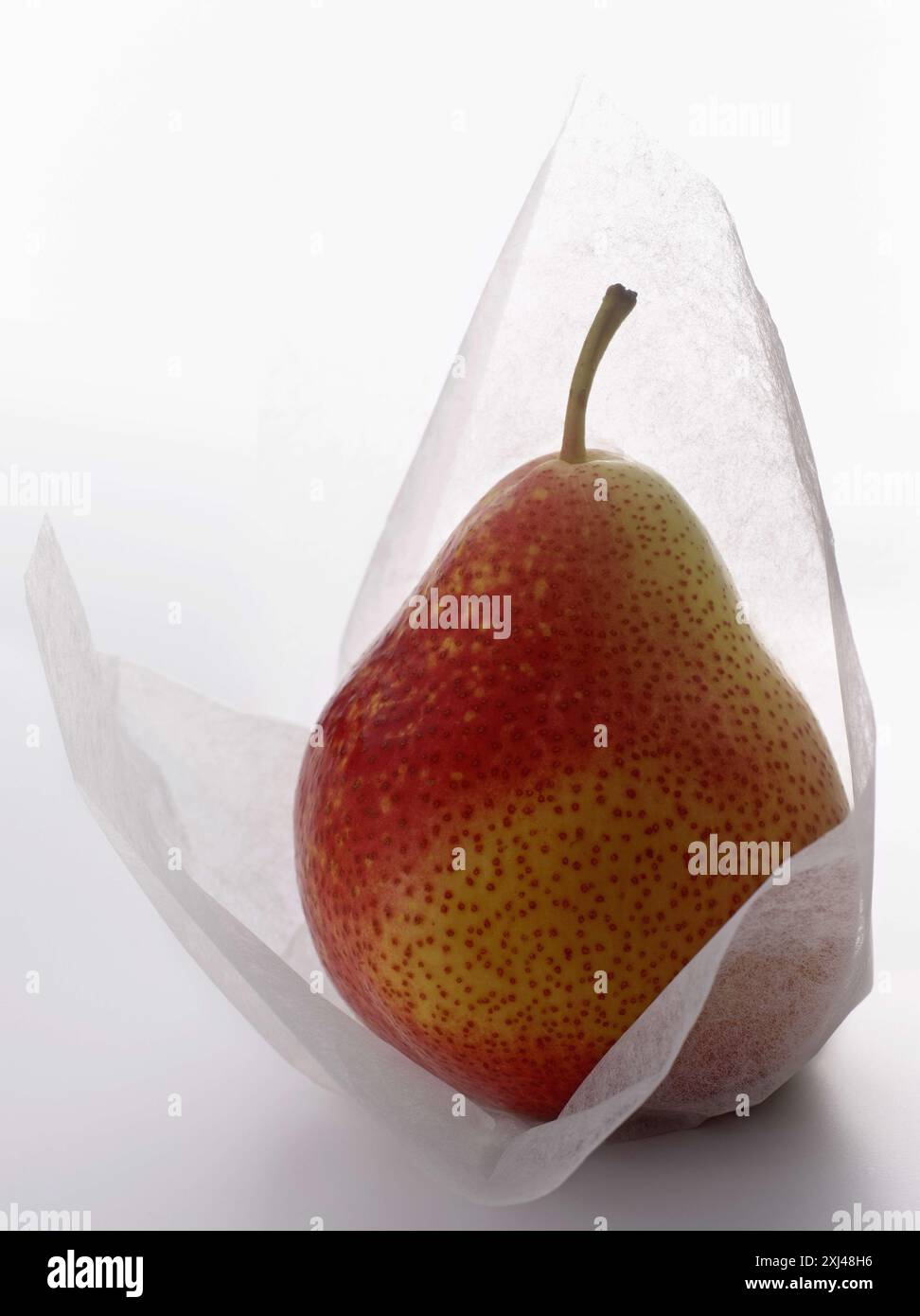 Forelle pear wrapped in paper Stock Photo - Alamy