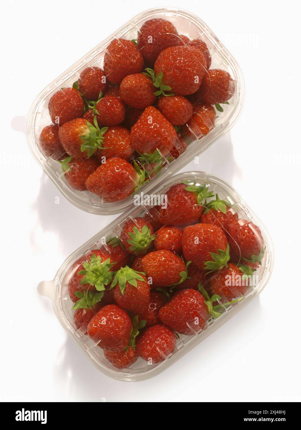 Two plastic punnets of strawberries Stock Photo - Alamy