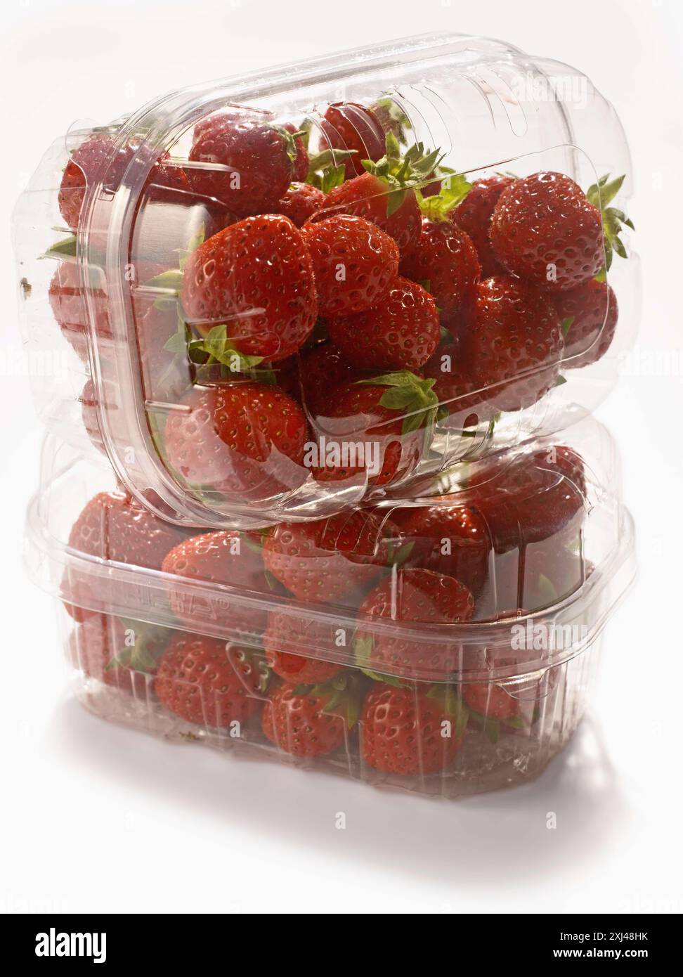 Two plastic punnets of strawberries Stock Photo - Alamy