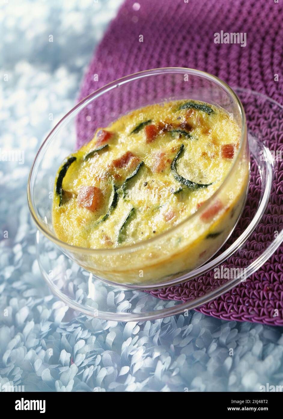 Courgette and diced raw ham baked flan Stock Photo - Alamy