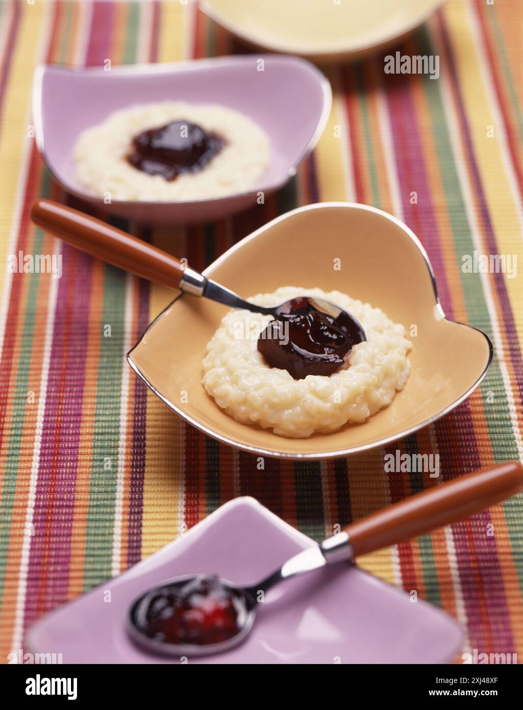 Rice pudding with redcurrant jelly Stock Photo - Alamy