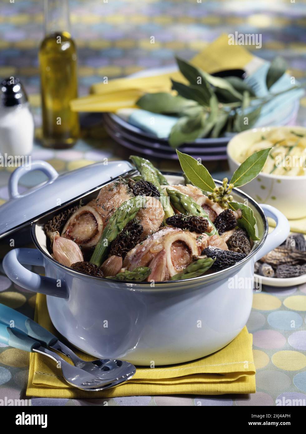 Veal knuckle with asparagus and morels Stock Photo - Alamy