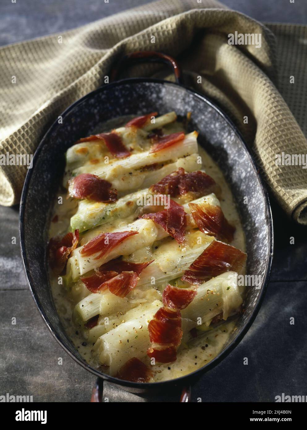 Baked leeks with ham Stock Photo - Alamy