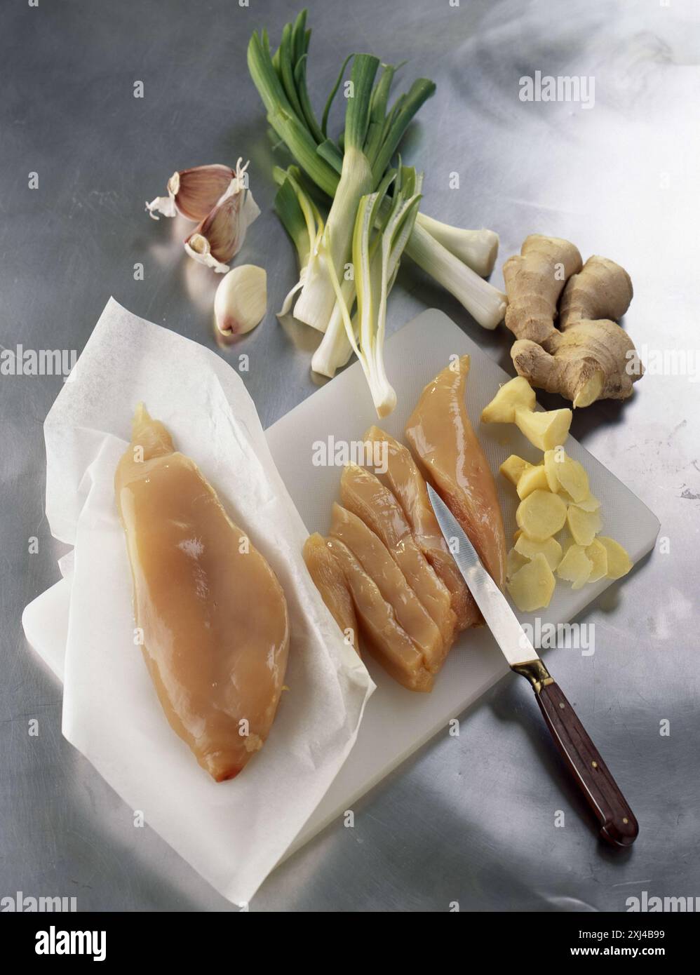 Cutting the meat into fine slices Stock Photo - Alamy