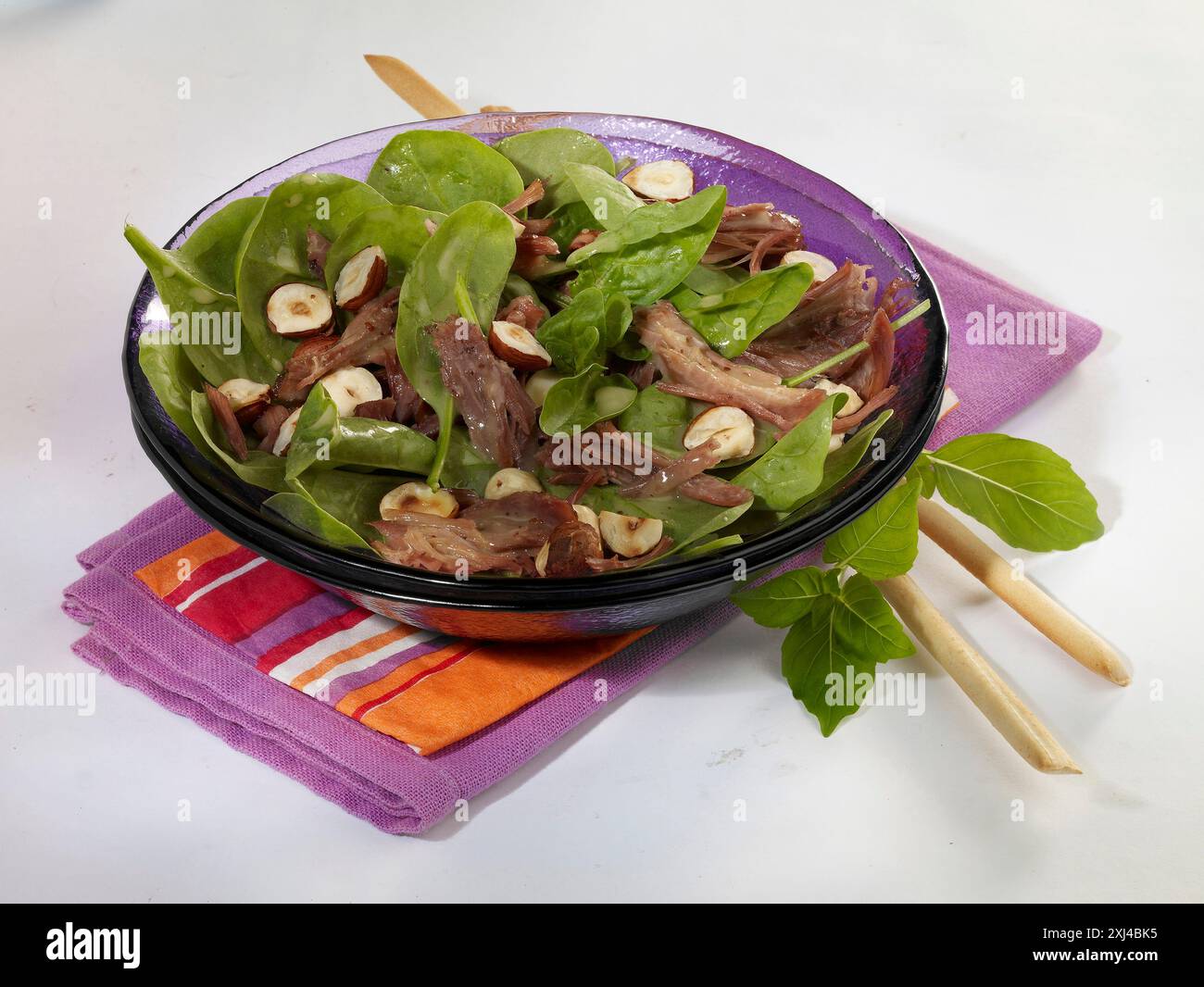 Duck and spinach shoot salad Stock Photo - Alamy