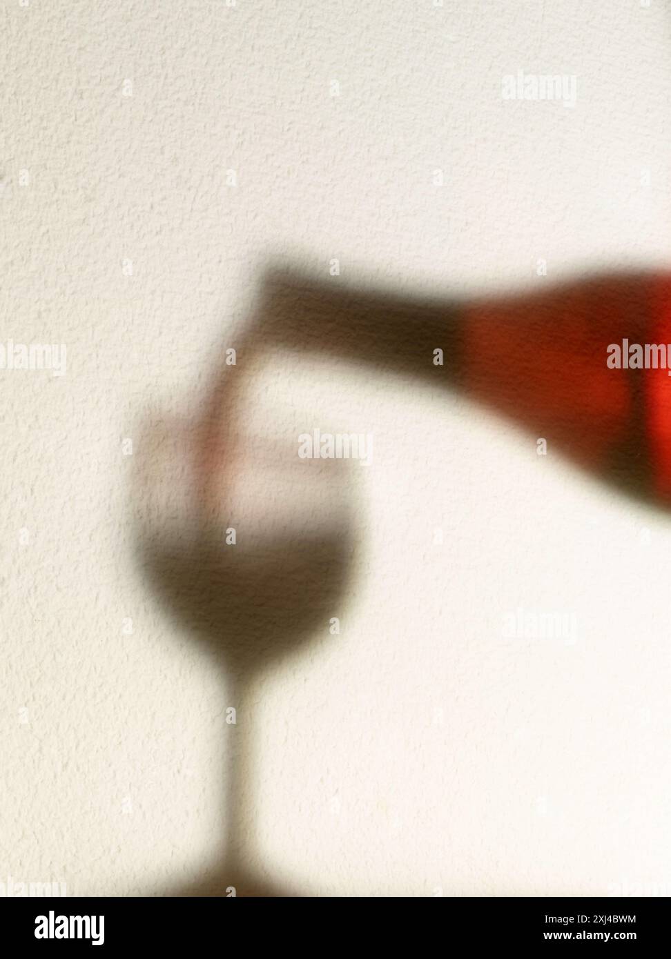 Shadow of a bottle and glass of red wine Stock Photo - Alamy