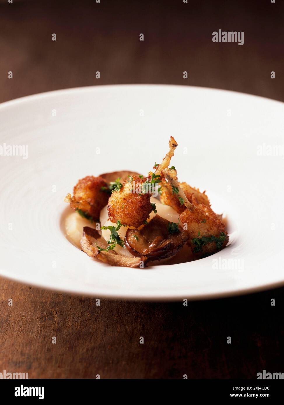Frog's leg and cep Fricassée Stock Photo - Alamy