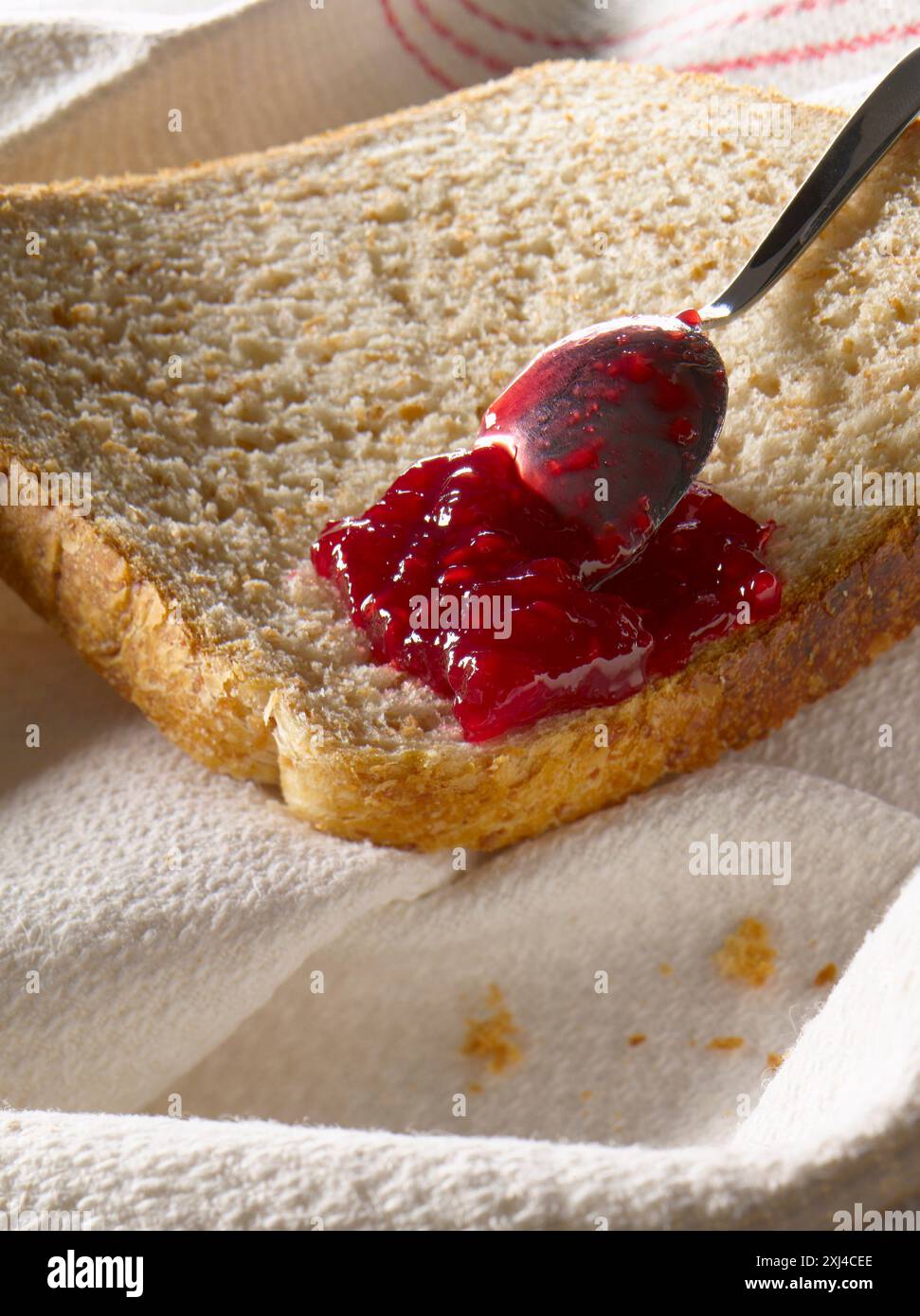 Slice of sandwich bread and jam Stock Photo - Alamy