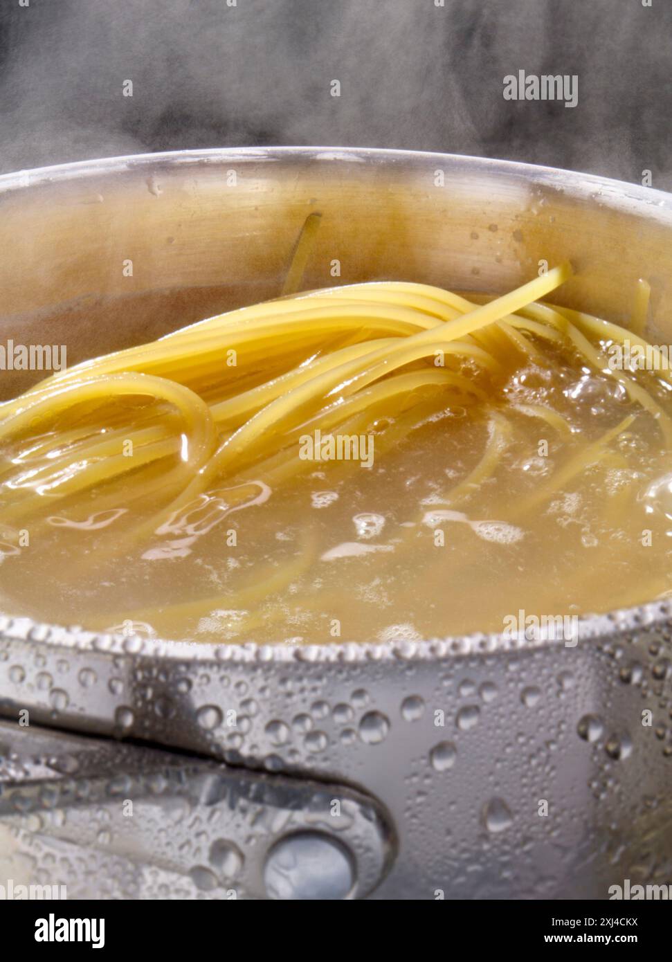 pasta cooking in boiling water Stock Photo - Alamy
