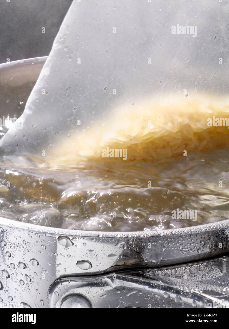 Bag of rice in boiling water Stock Photo - Alamy