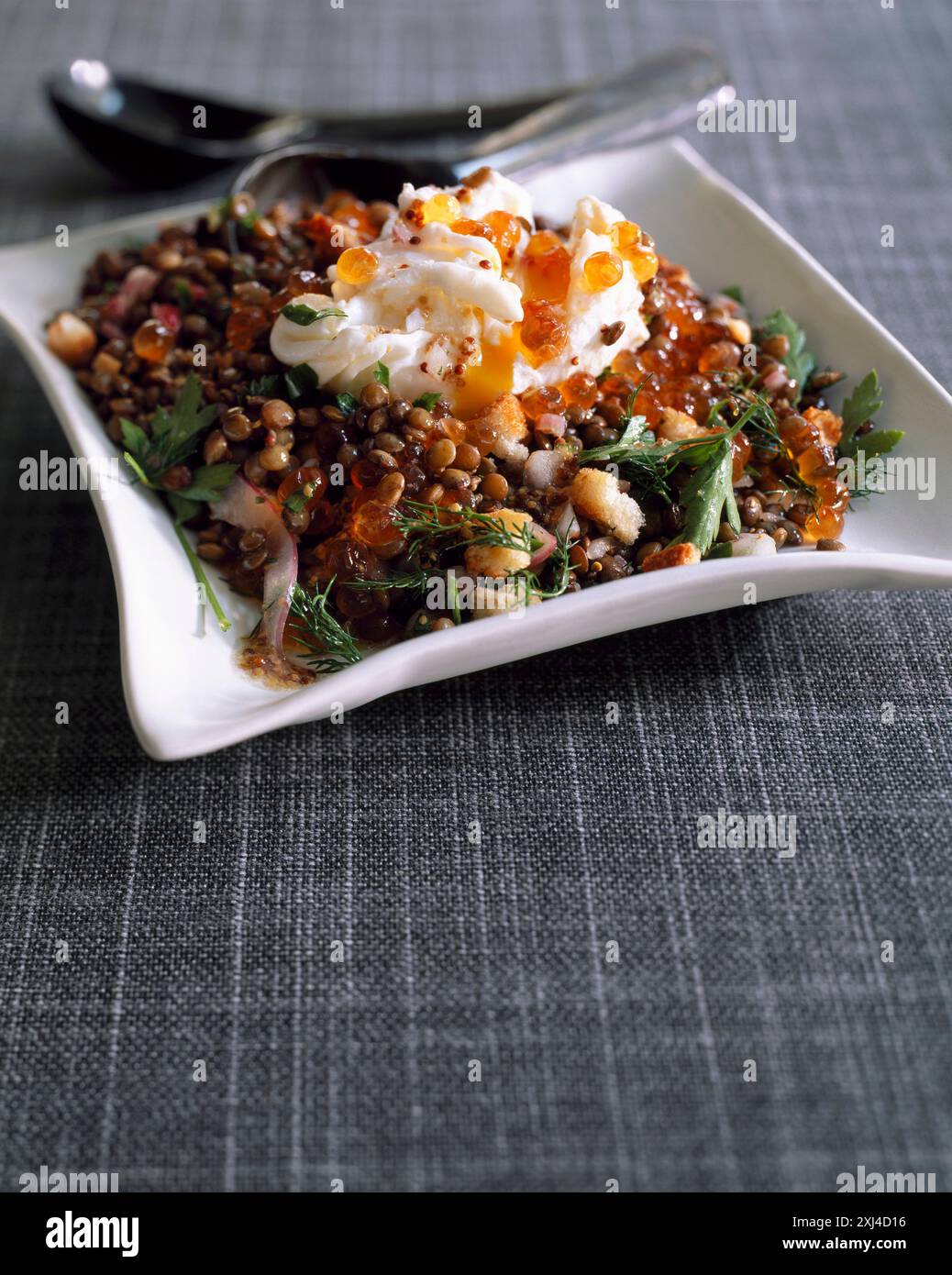 Lentil salad with poached egg and lumpfish roe Stock Photo - Alamy