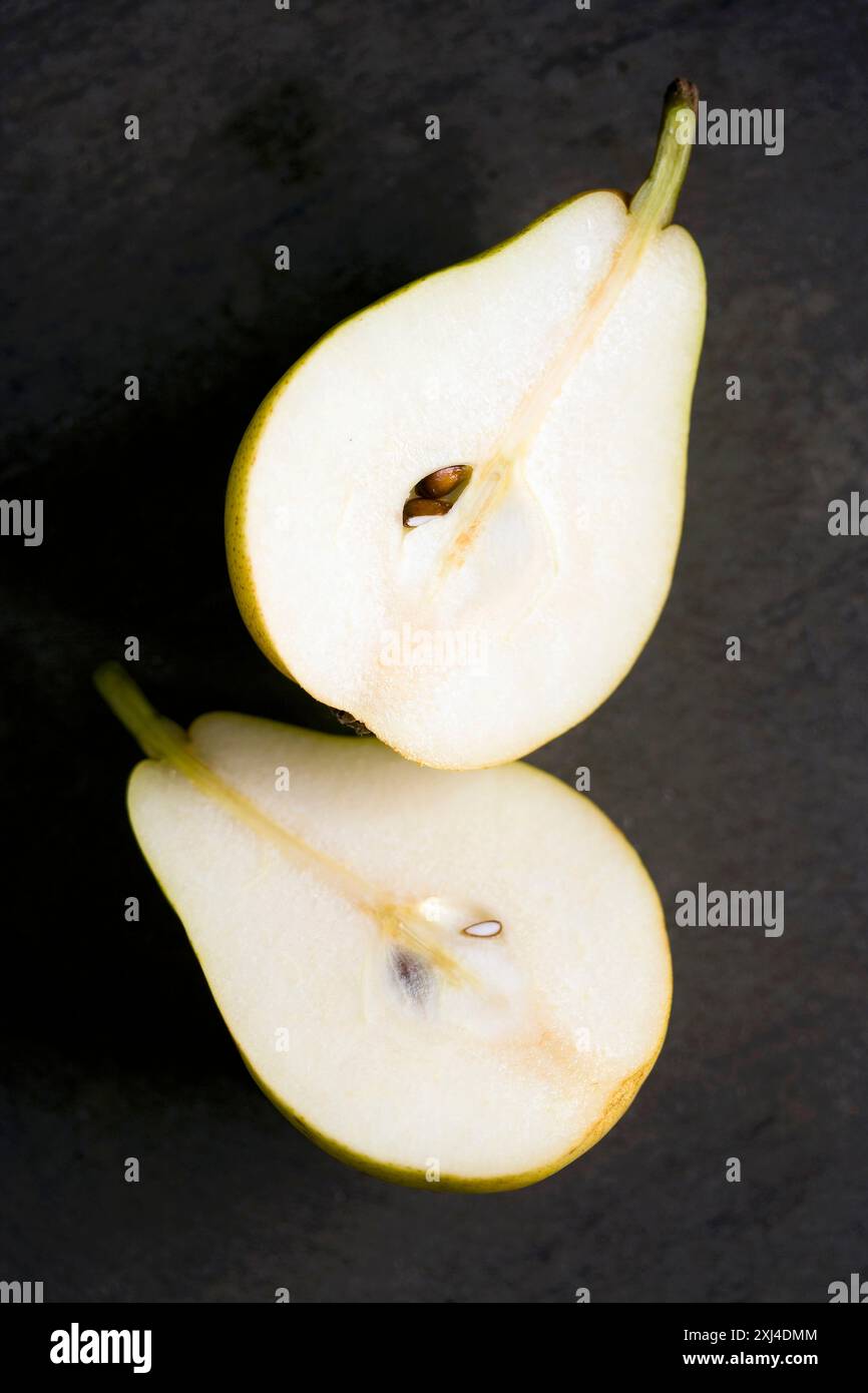 Pear cut in half Stock Photo - Alamy