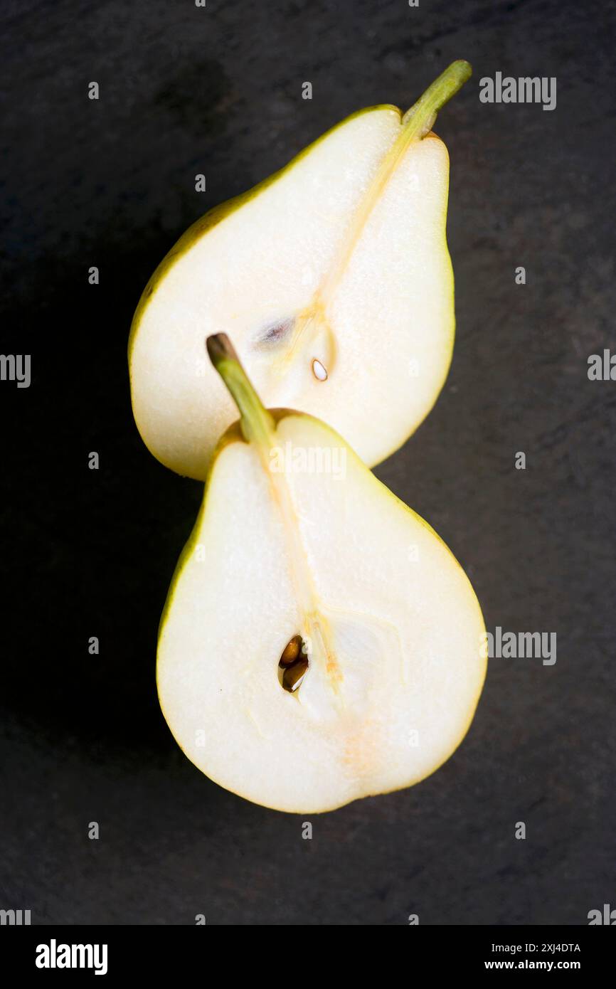 Pear cut in half Stock Photo - Alamy