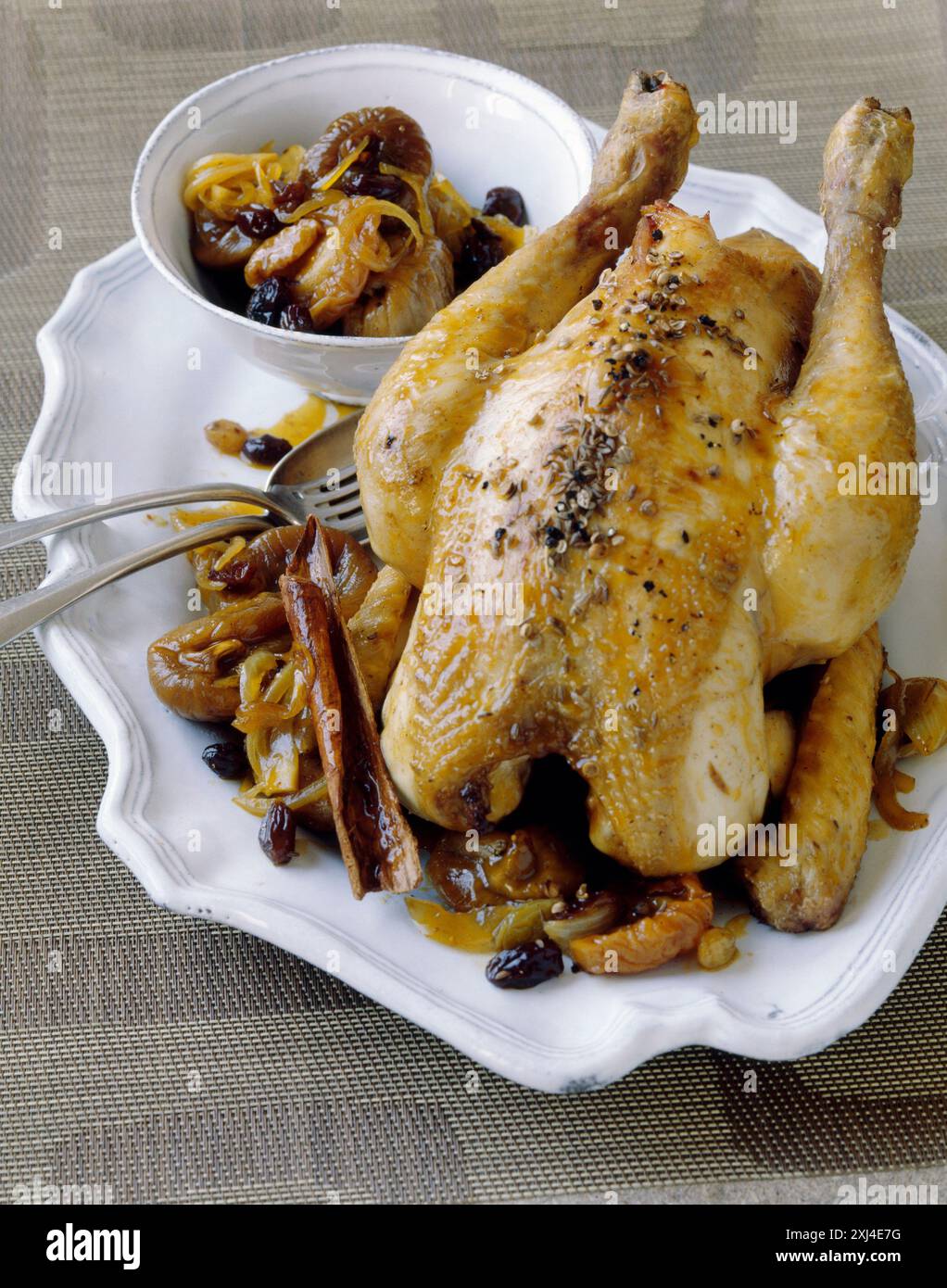 Capon and figs with saffron Stock Photo - Alamy