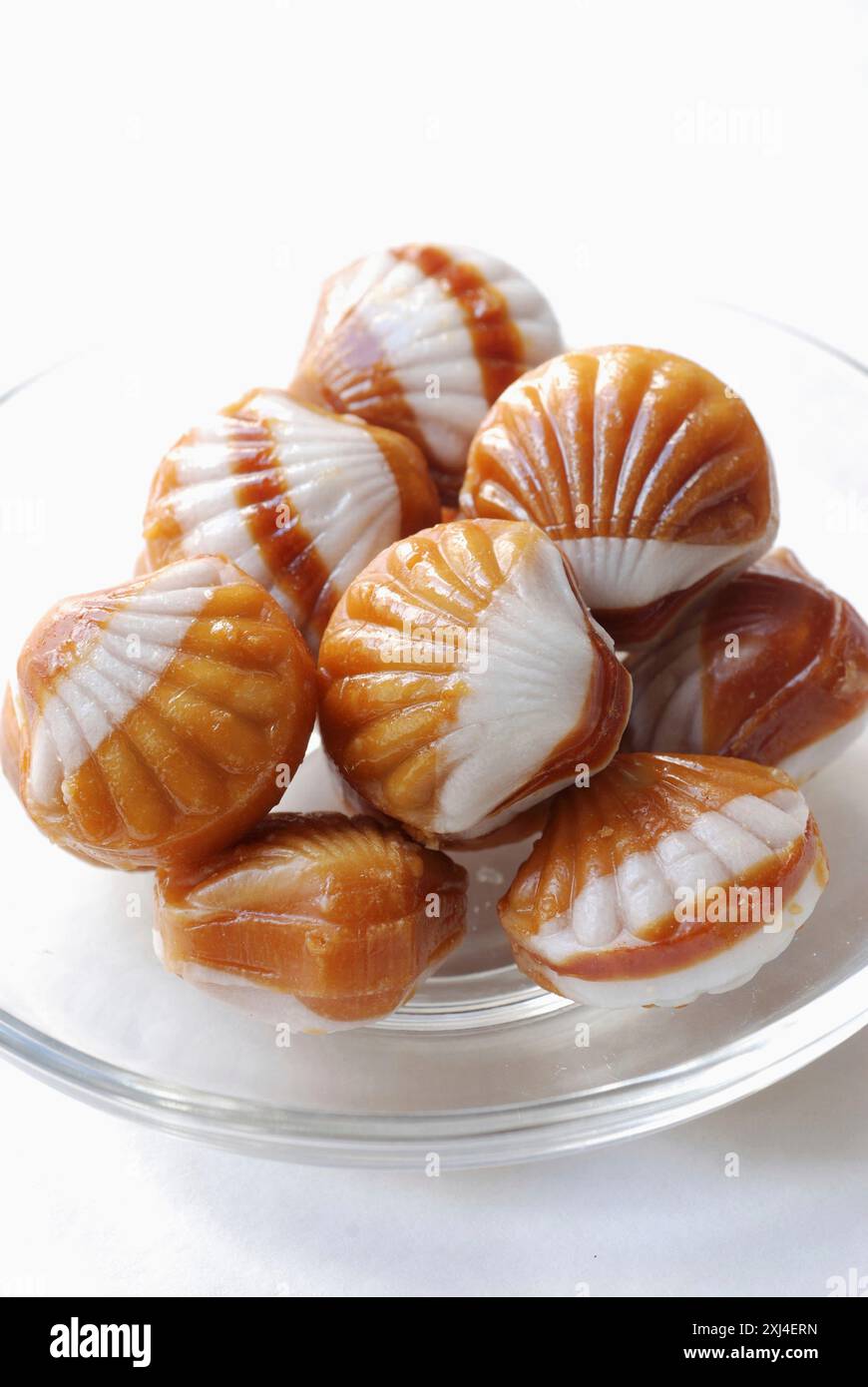 Shell-shaped caramel sweets Stock Photo - Alamy