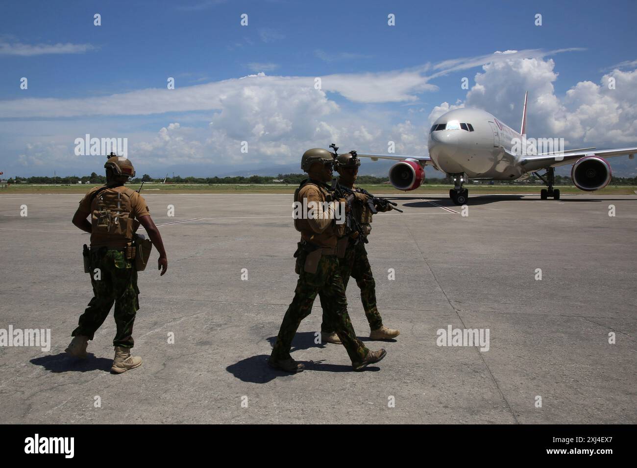 Kenyan police who are part of a UN-backed multinational force patrol ...