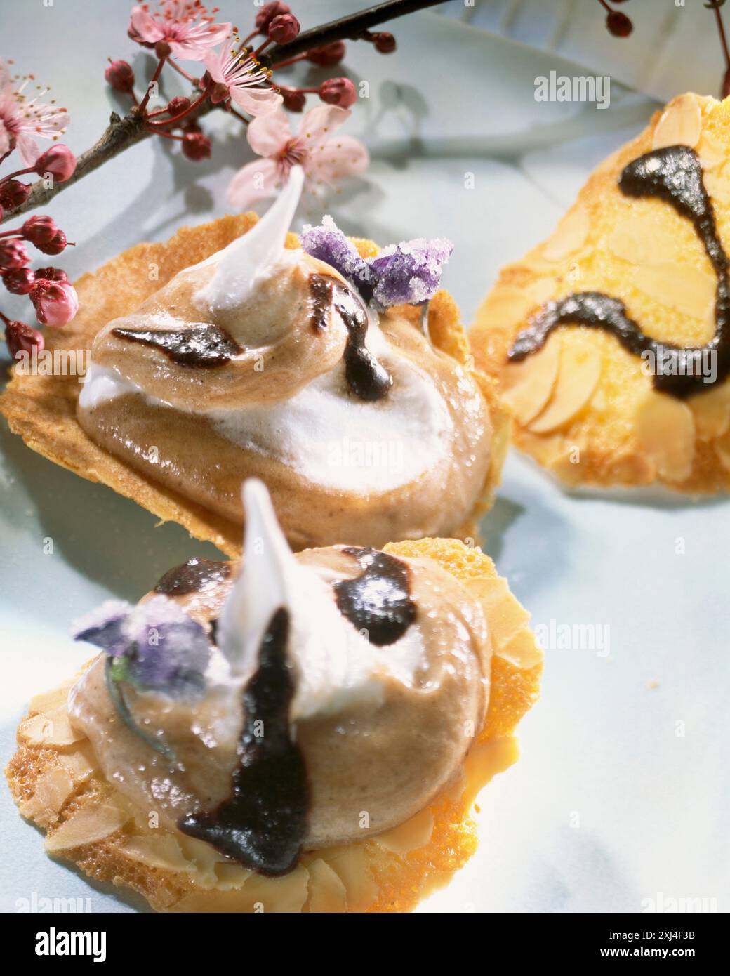 Upside down tuile biscuits filled with chestnut mousse Stock Photo - Alamy