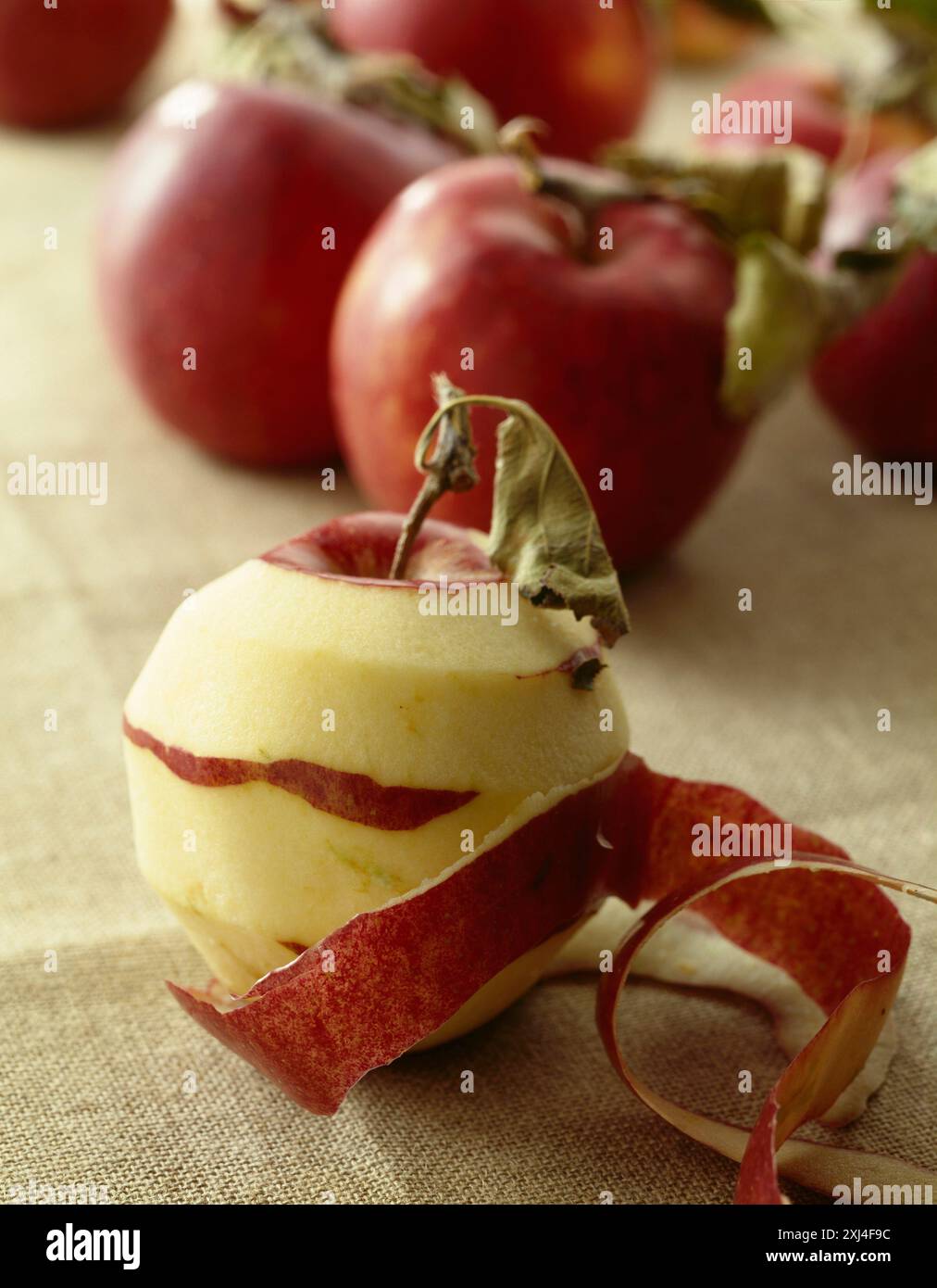 Peeling a red apple Stock Photo - Alamy