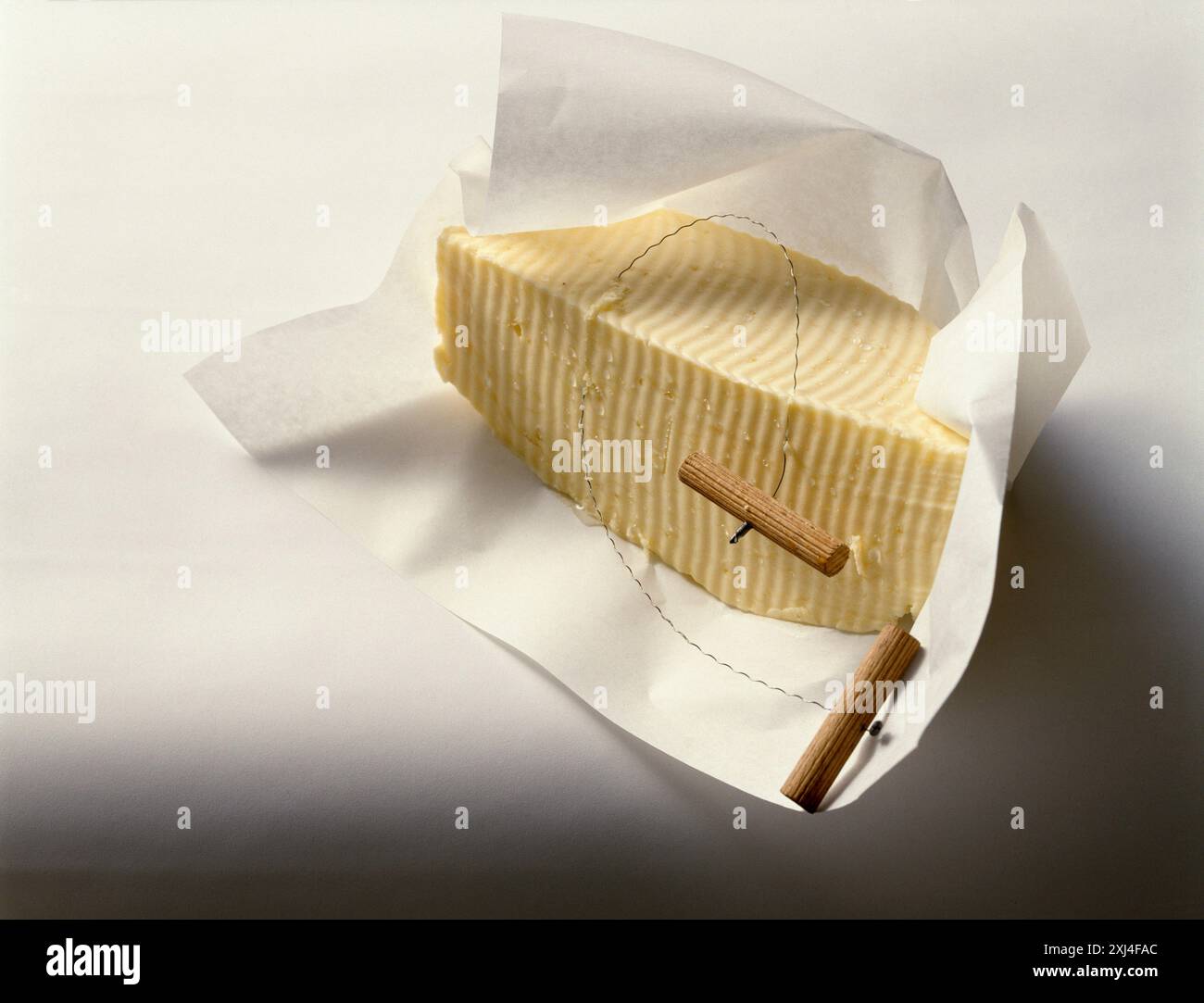 Slab of butter and butter slicing wire Stock Photo - Alamy