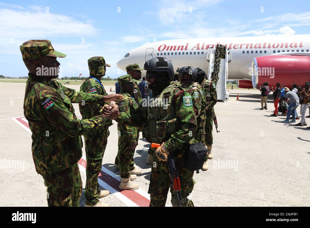 Kenyan police that are part of a UN-backed multinational force welcome ...