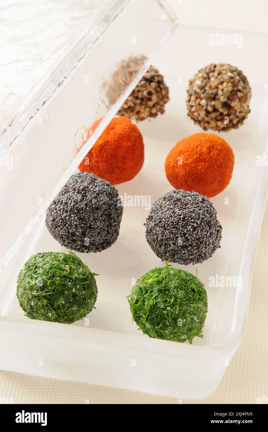 Four flavored goat's cheese balls Stock Photo - Alamy