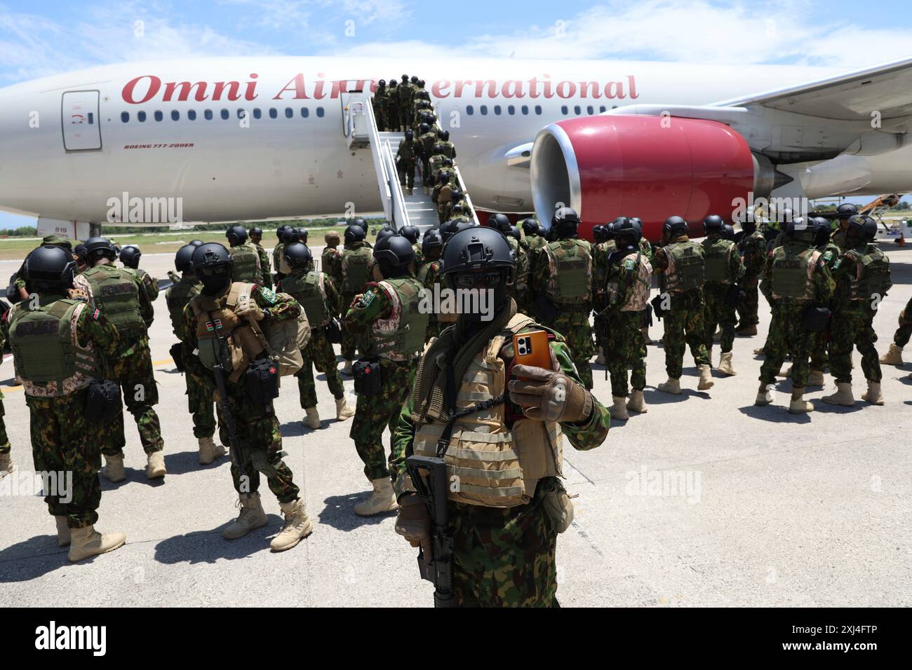A Kenyan police officer who is part of a UN-backed multinational force ...