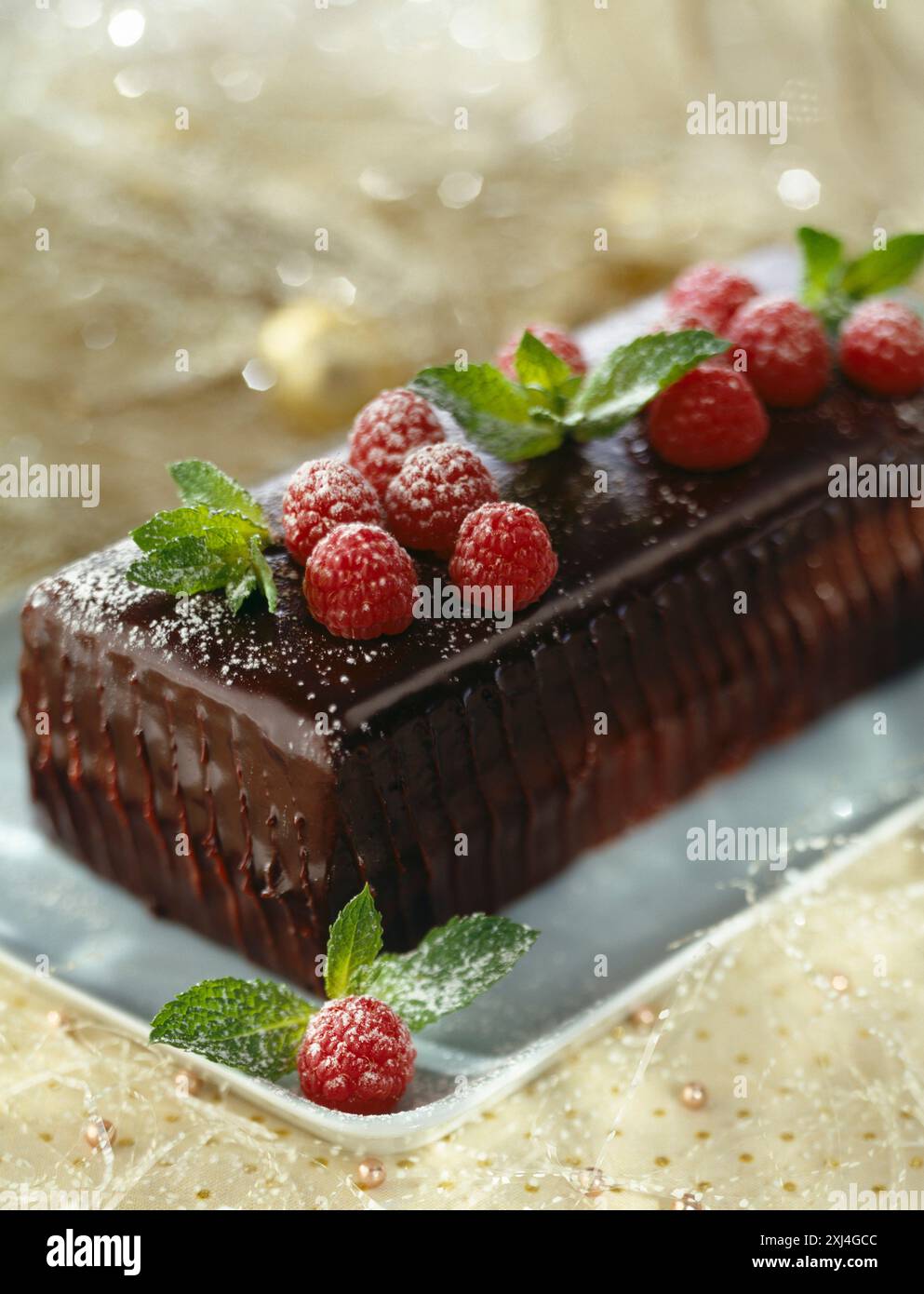 Chocolate and raspberry log cake Stock Photo - Alamy