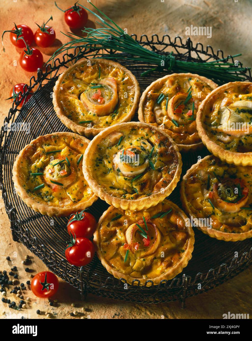 Individual two salmon quiches Stock Photo - Alamy