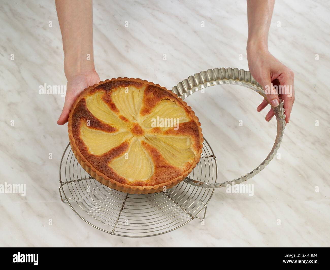 Removing the tart from the tin mould Stock Photo - Alamy