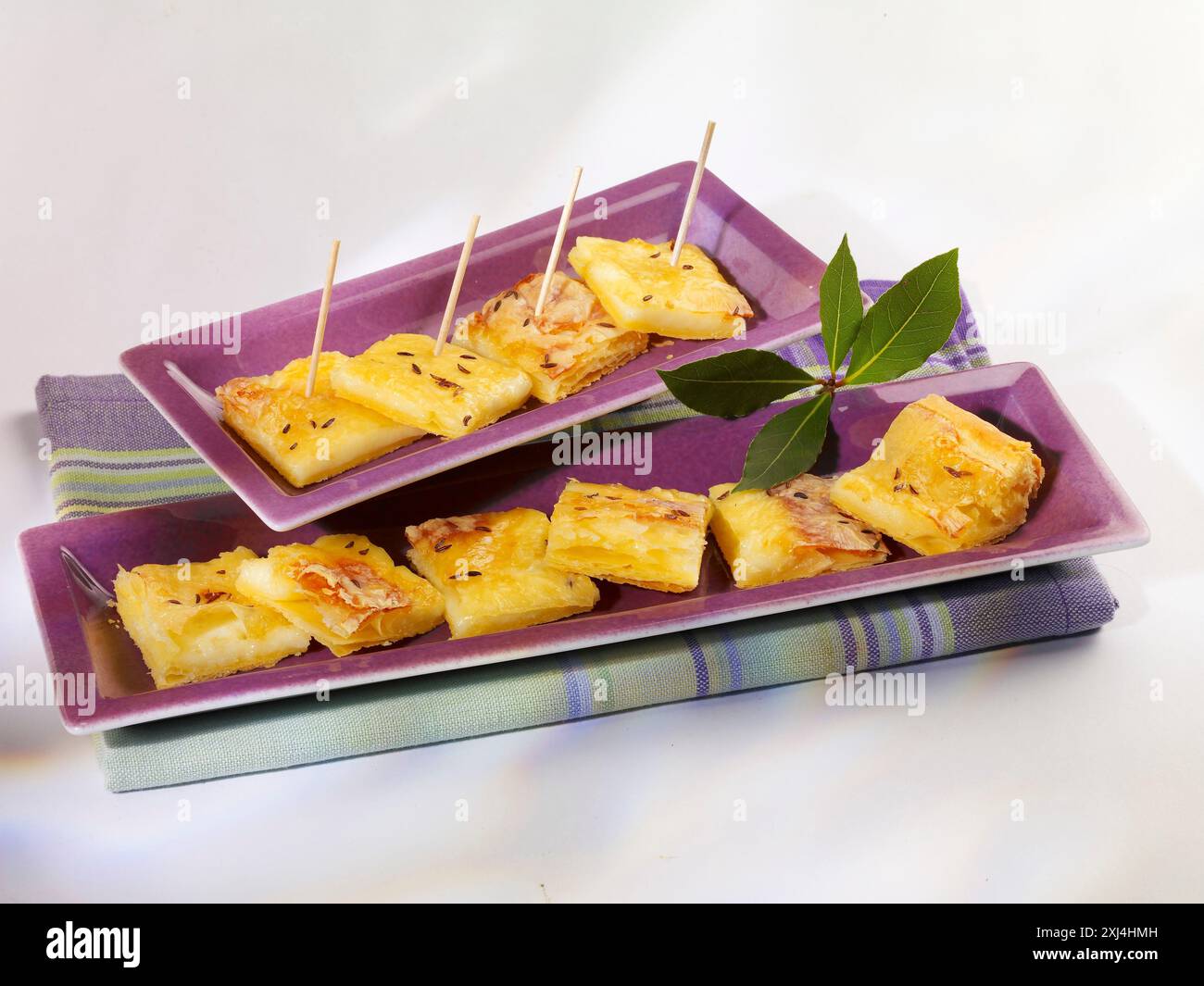 Bite-size flaky pastry with Reblochon Stock Photo - Alamy