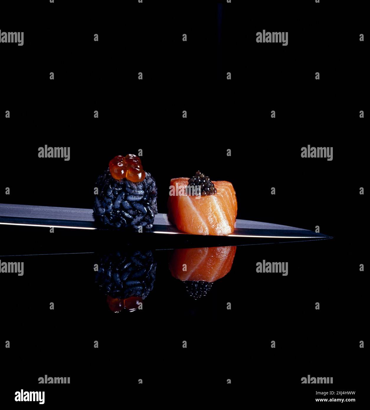 Square duo;rice with squid ink and salmon roe ,raw salmon and caviar ...