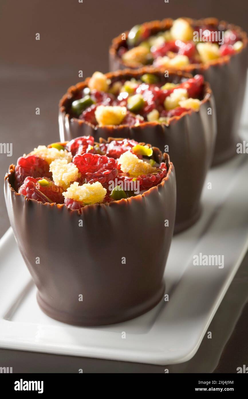 Dark chocolate verrines with crumbled sponge cake,raspberries and ...