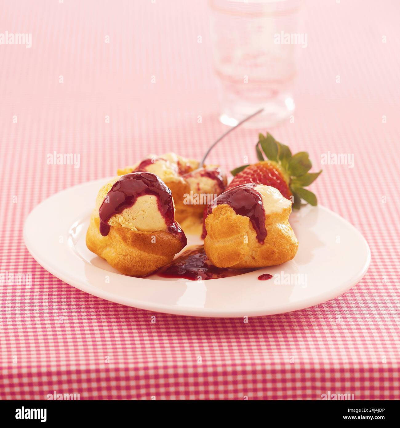 Cream filled puff pastry profiteroles hi-res stock photography and ...