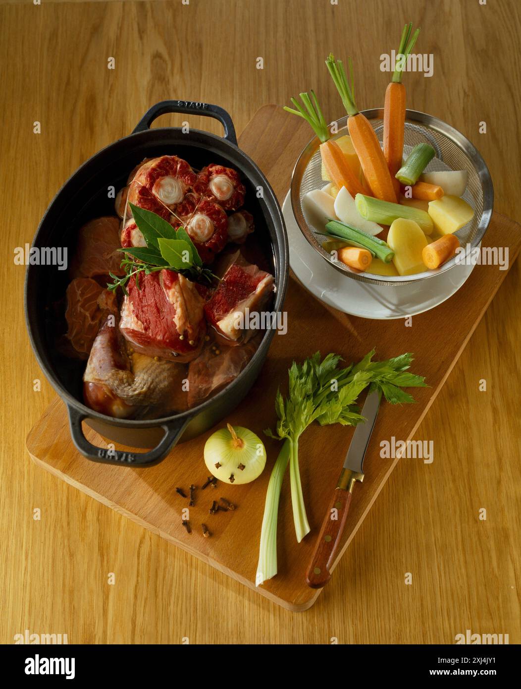 Cooking the meat in a casserole dish Stock Photo - Alamy