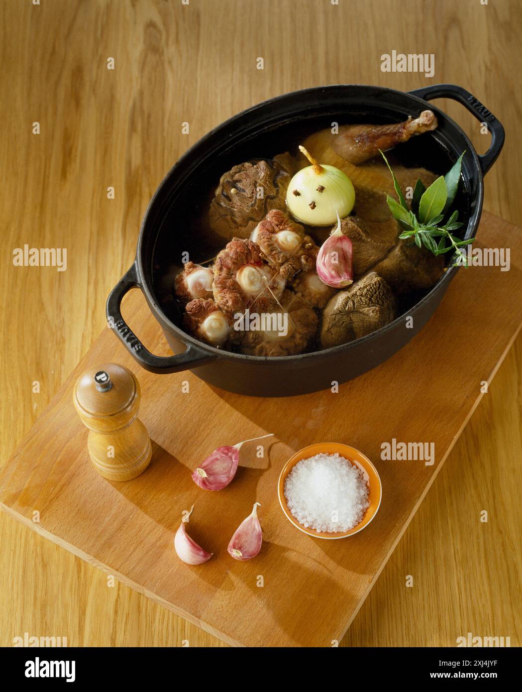 Adding the herbs and spices Stock Photo - Alamy