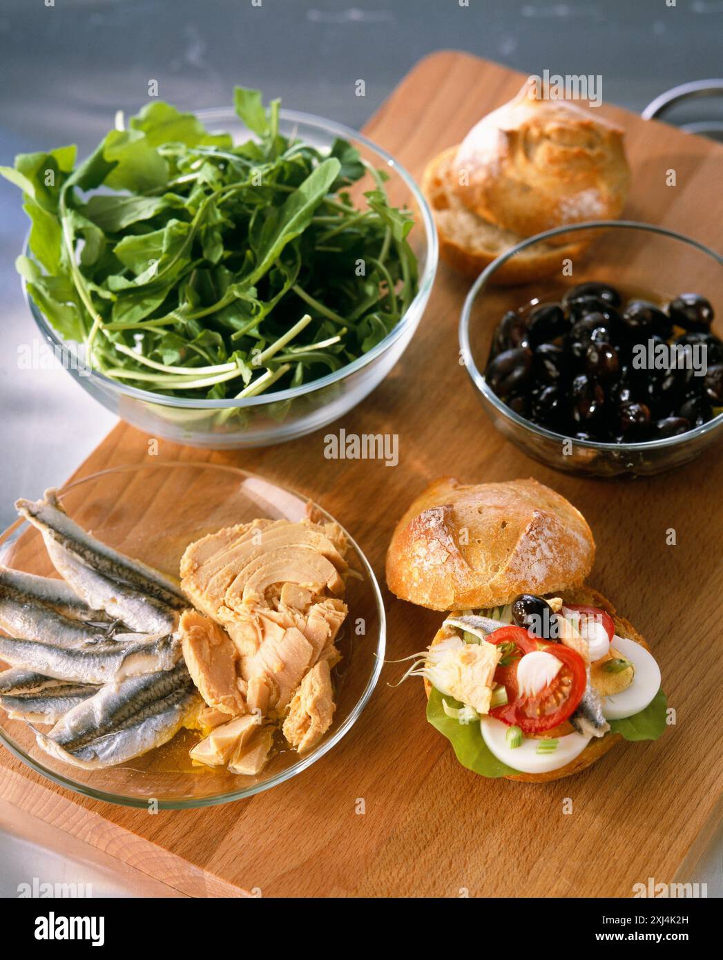 Filling the bread with the ingredients Stock Photo - Alamy