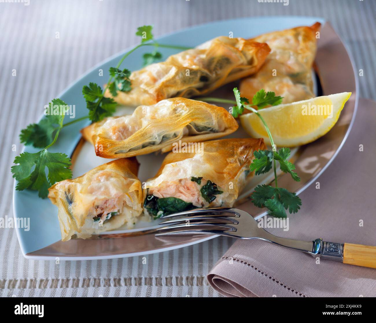 Salmon and basil filo pastry pies Stock Photo - Alamy