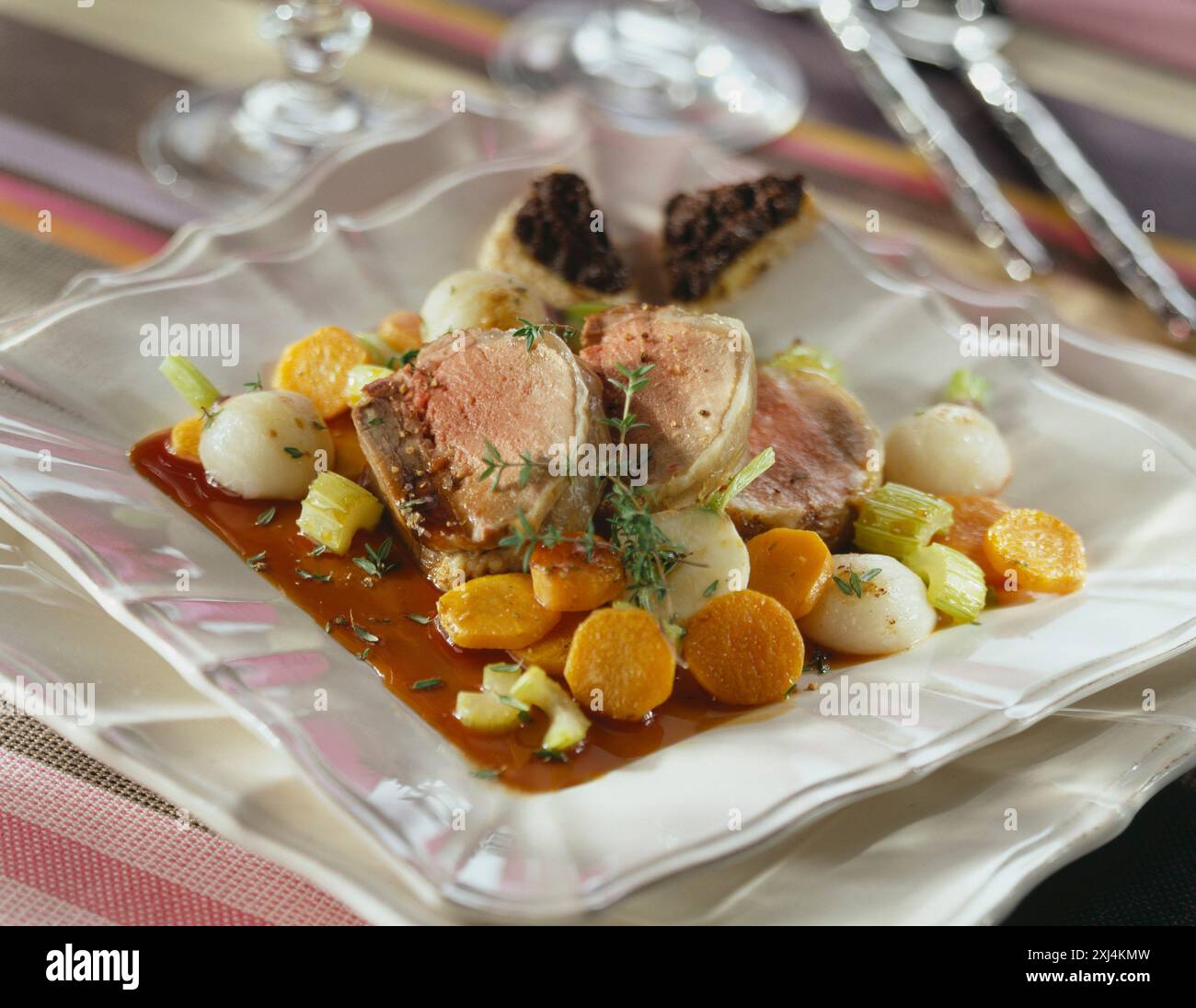 Lamb with vegetable and red wine sauce Stock Photo - Alamy