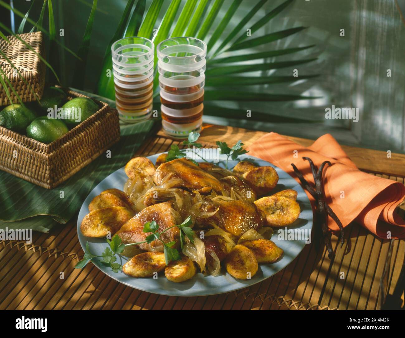 Vanilla flavoured chicken with bananas and onions Stock Photo - Alamy