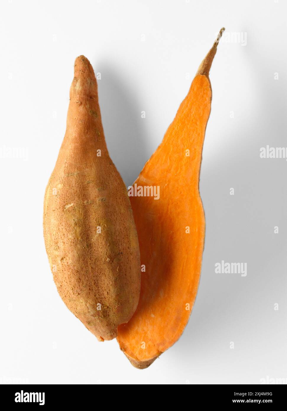 Sweet potato cut in half Stock Photo - Alamy