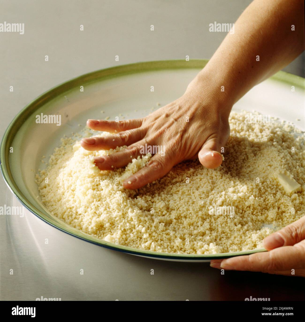Smoothing out the semolina with one's hands Stock Photo - Alamy