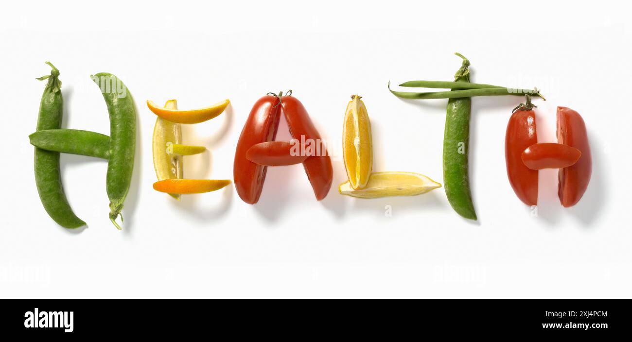Health written with fruit and vegetables Stock Photo - Alamy