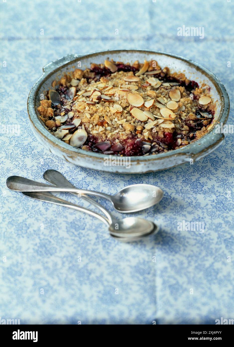 Summer fruit and two almond crumble Stock Photo - Alamy