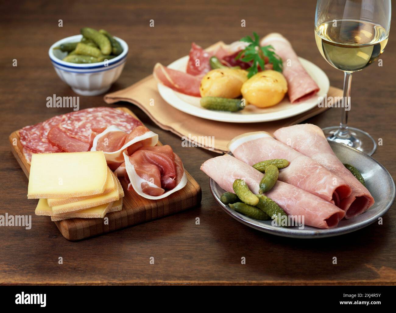 Cold cuts and cheese for Raclette Stock Photo - Alamy