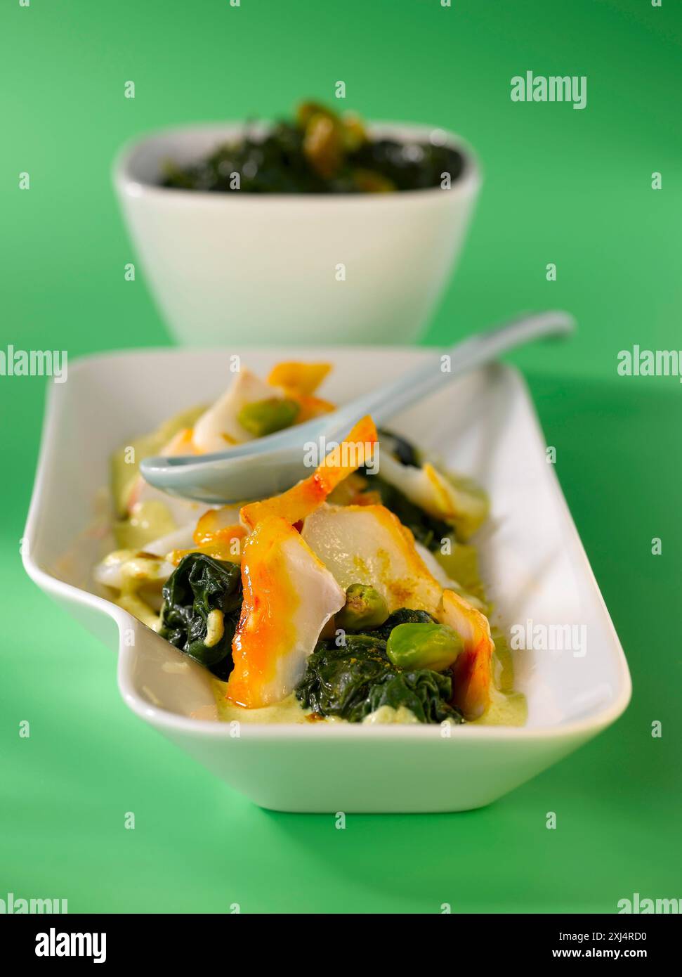 Haddock and spinach curry Stock Photo - Alamy