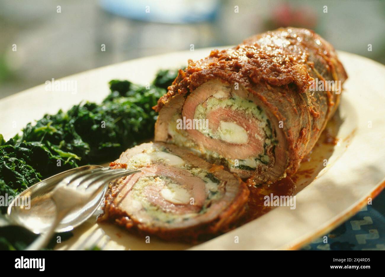 Rolled roast beef stuffed with spinach Stock Photo - Alamy