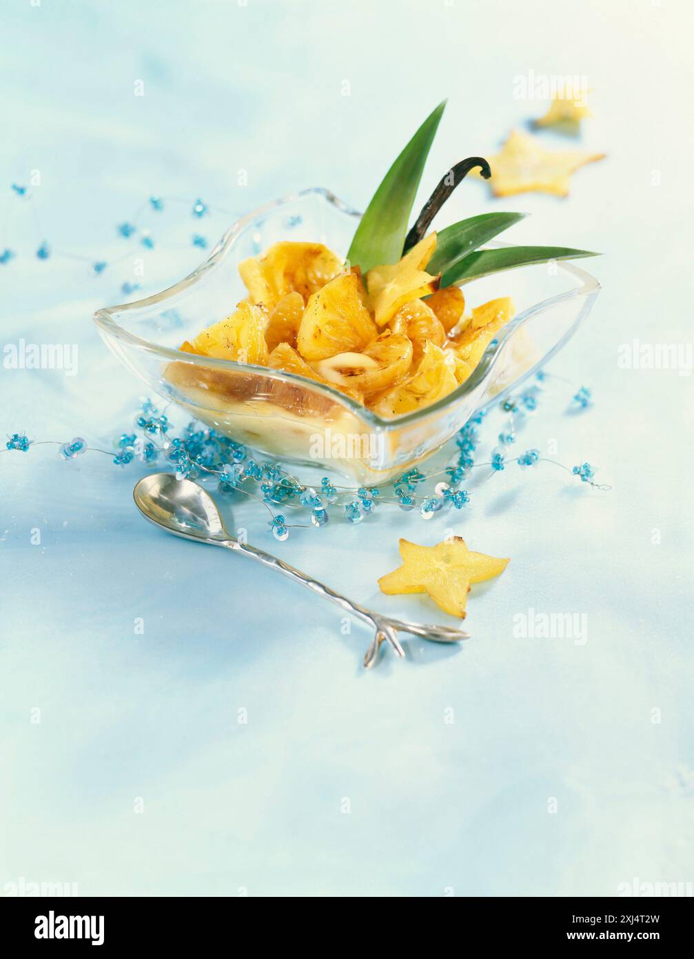 Pan-fried caramelized exotic fruits with rum and vanilla sauce Stock ...