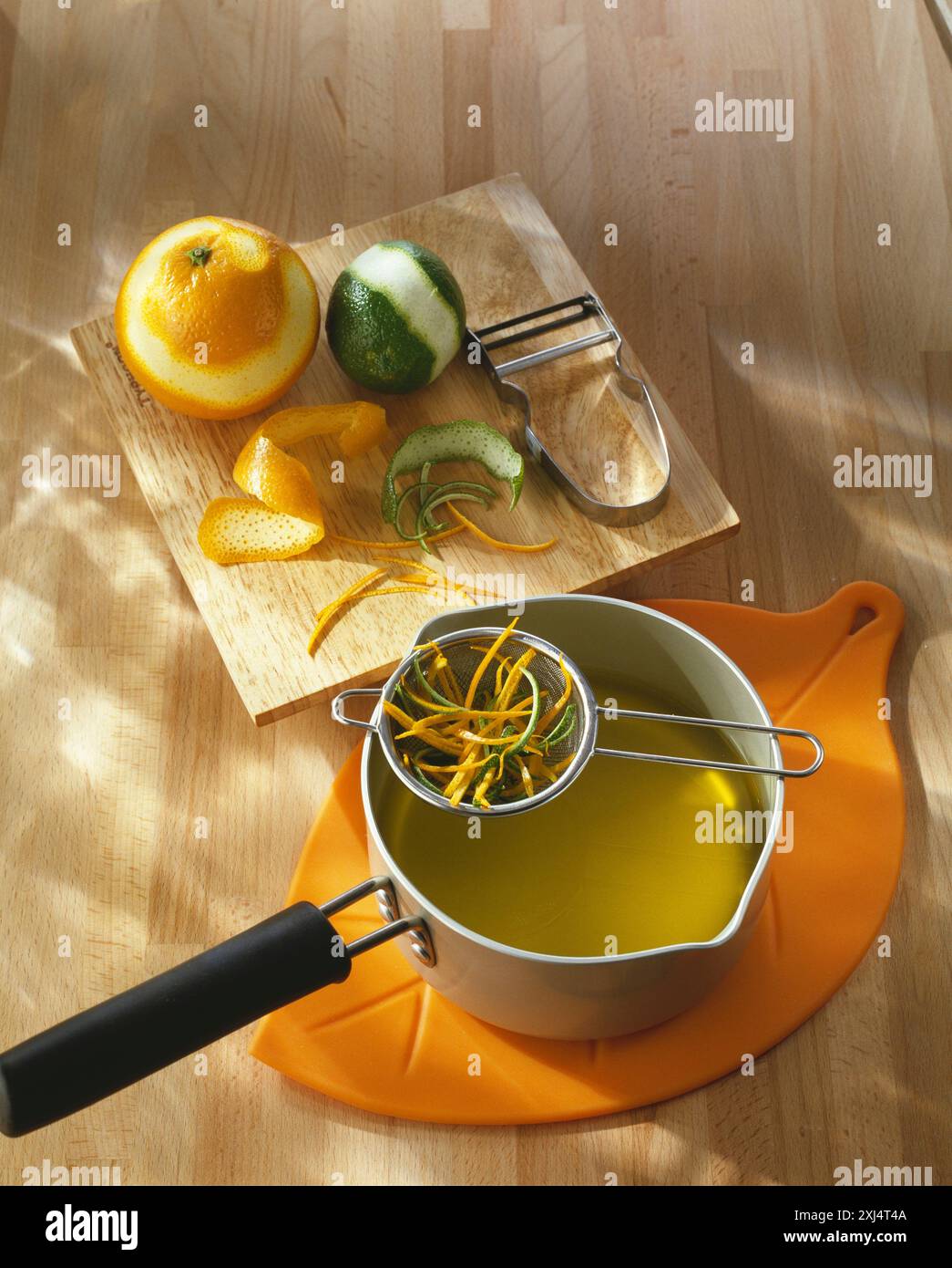 Making orange and lime zests Stock Photo - Alamy
