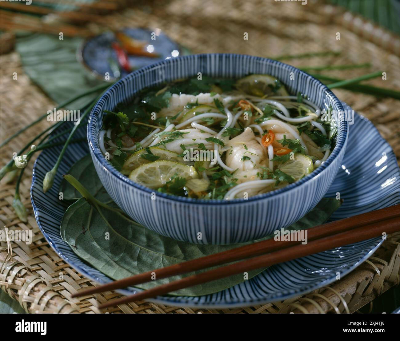 Squid broth with noodles Stock Photo - Alamy