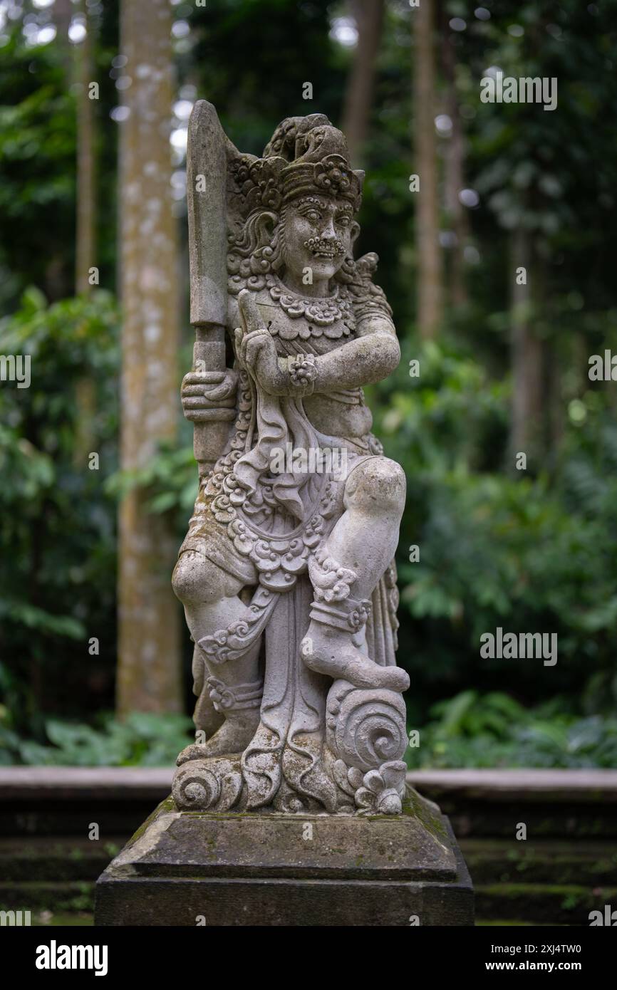 Religious sculpture portraits in Monkey Forest in Bali, front view ...